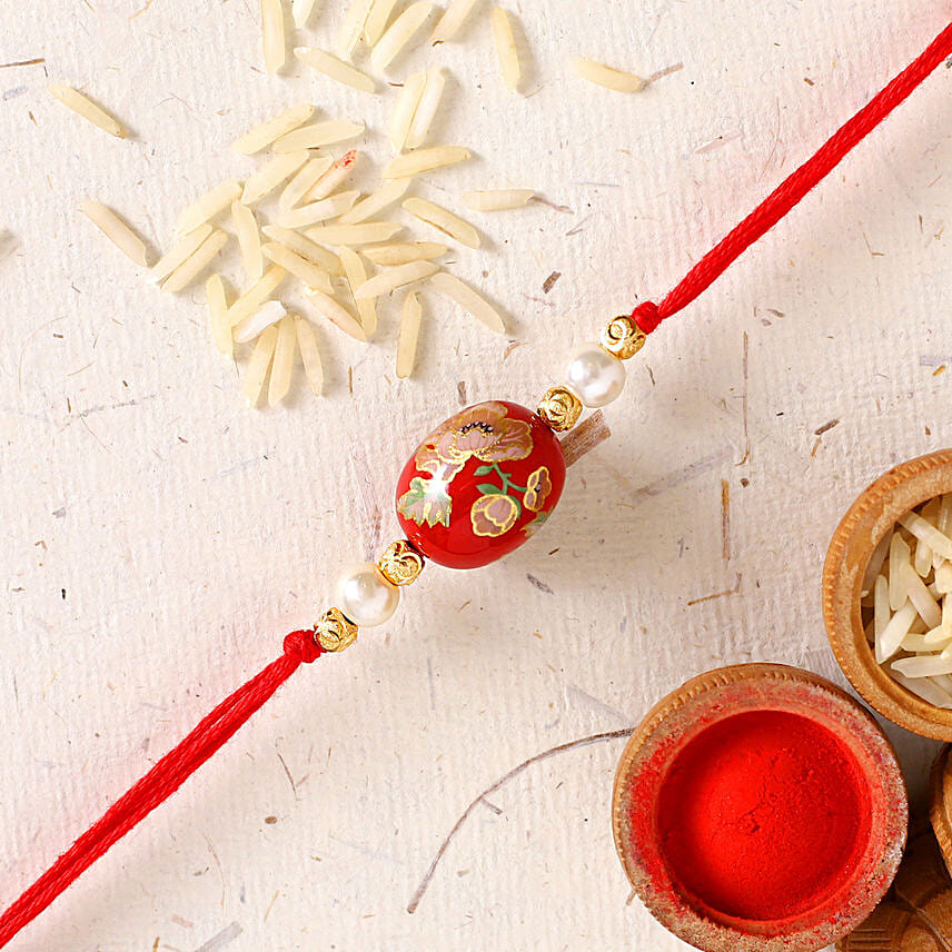 Online Japanese Red Stone Mauli Rakhi Gift Delivery in UAE - FNP