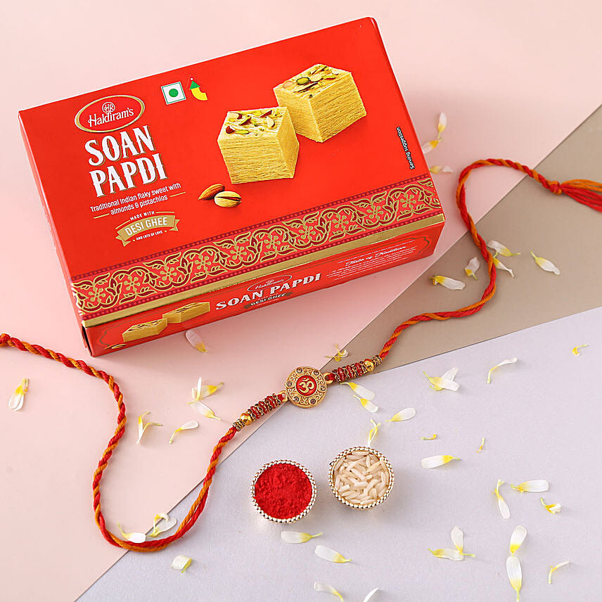 Order Sneh Traditional Om Rakhi with 500 Grams Soan Papdi Online | Same ...