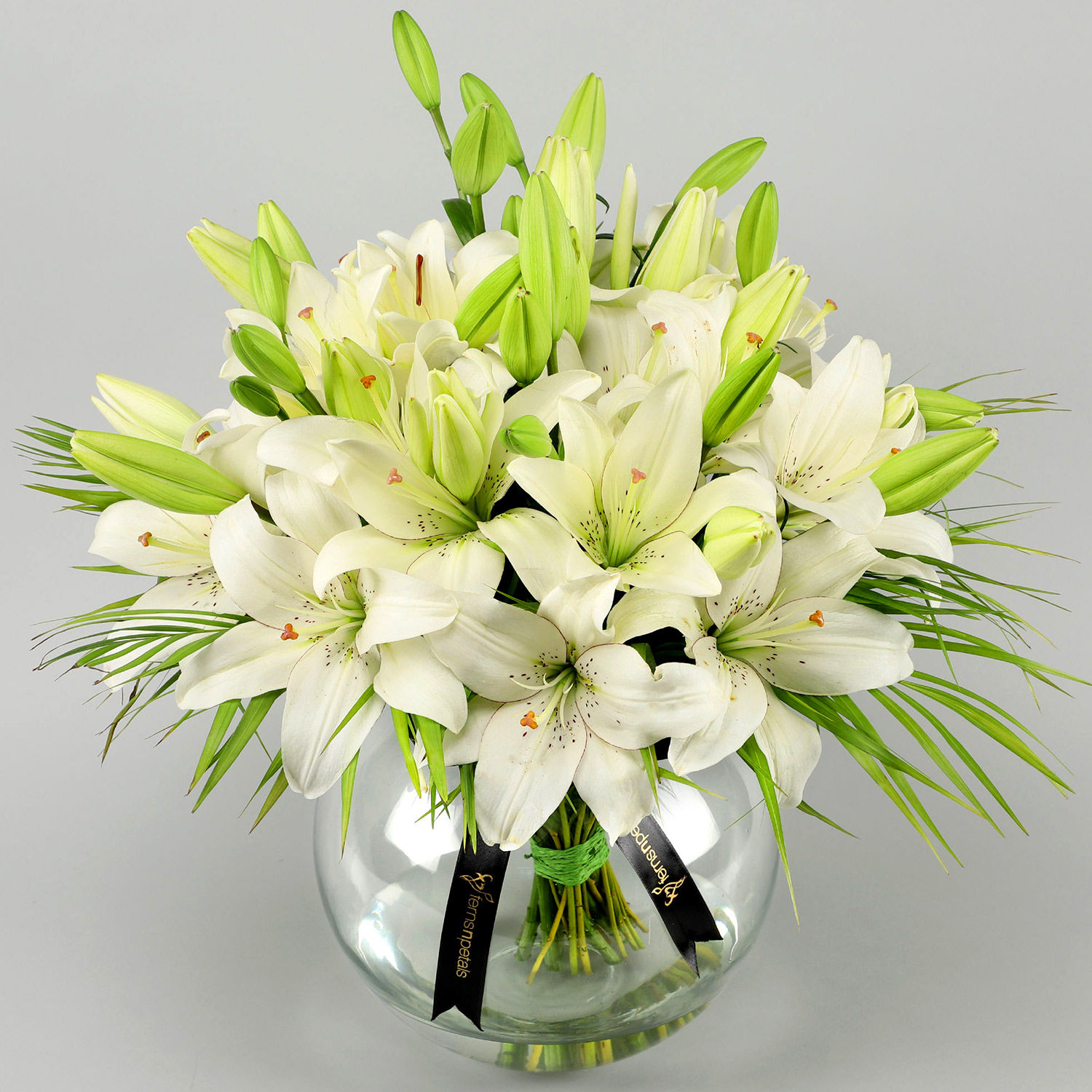أون لاين Lilies Happiness Arrangement توصيل هدايا في Lebanon - FNP