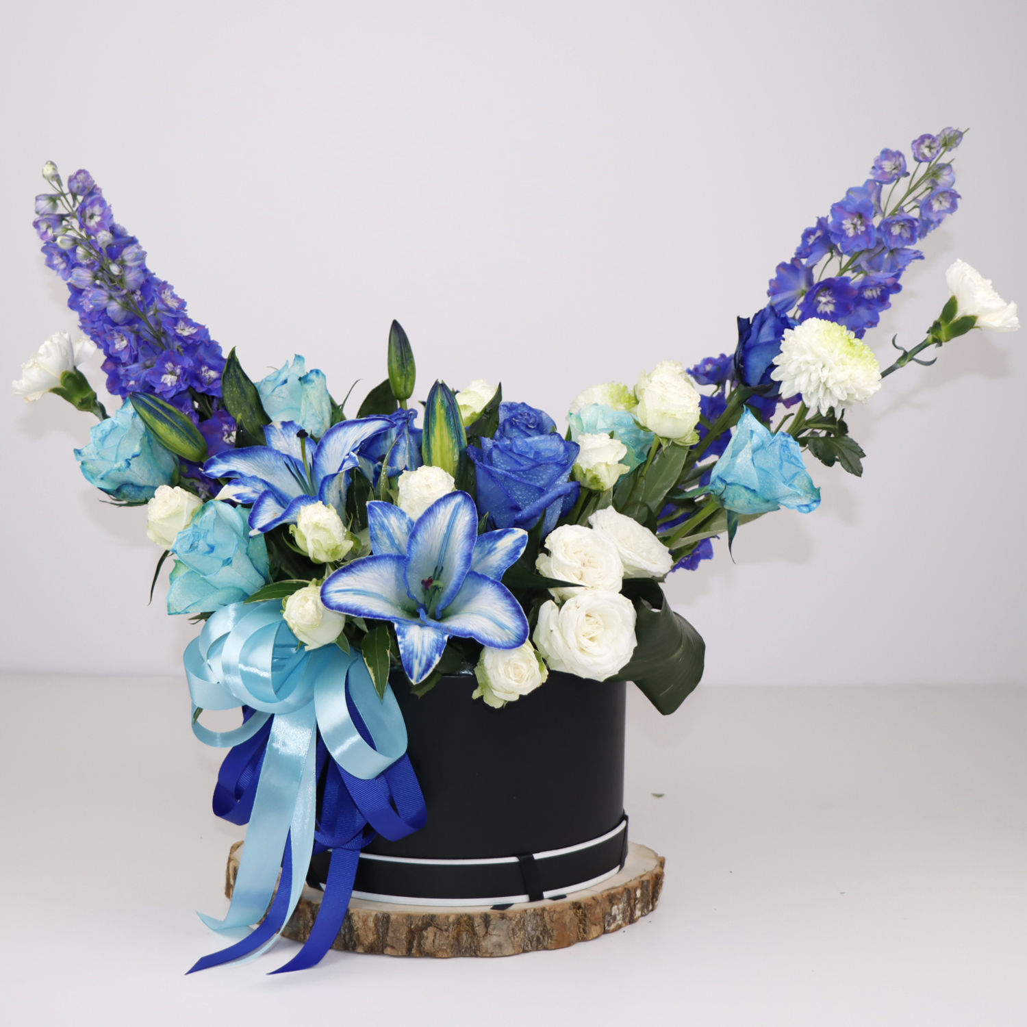Online Bloomy Blue Flowers Box Arrangement Gift Delivery in Oman - Fnp.ae