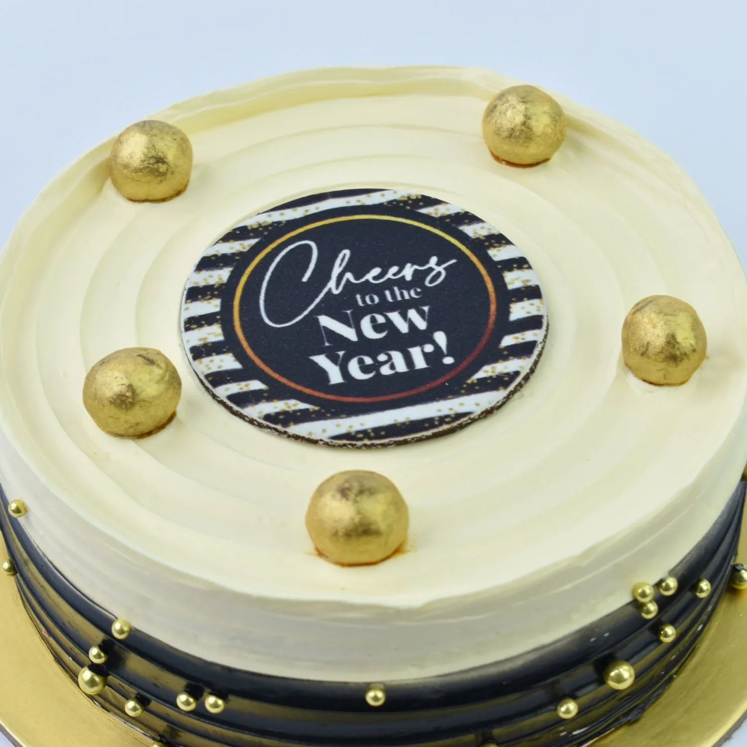 Online Cheers New Year Chocolate Cake Gift Delivery in UAE - FNP