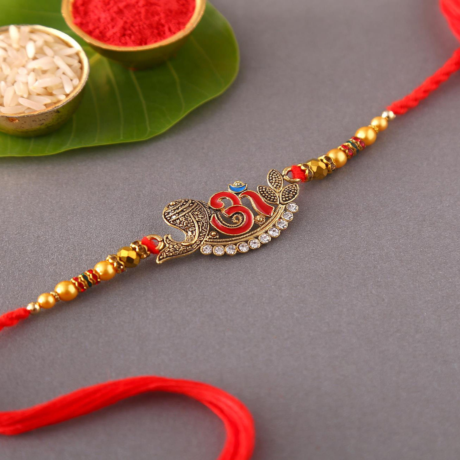 Order Sneh Embellished Om Rakhi Online | Same-Day Delivery UAE - Fnp.ae