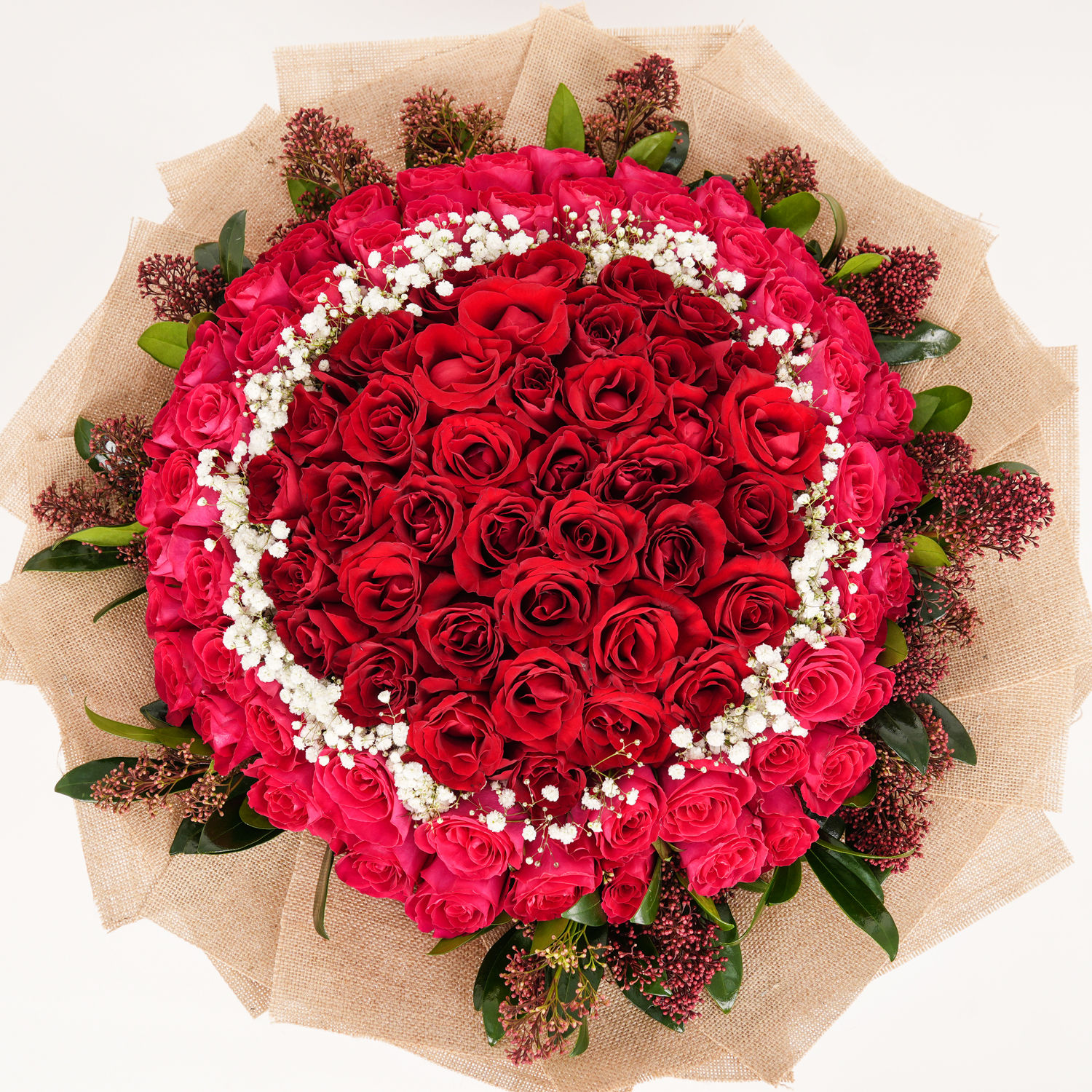 Order 75 Roses and Skimmia Bouquet Online | Same-Day Delivery UAE - Fnp.ae